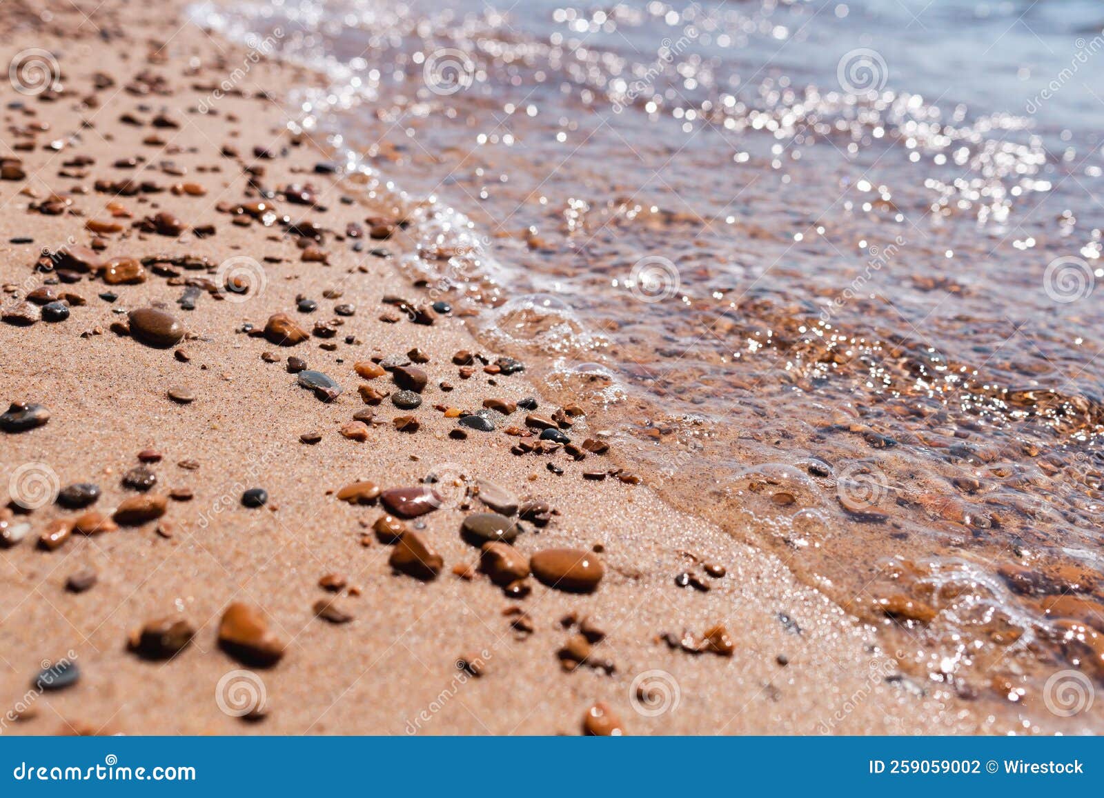 Selective Focus Shot of Small Pebbles on the Beach Sand. Stock Photo ...