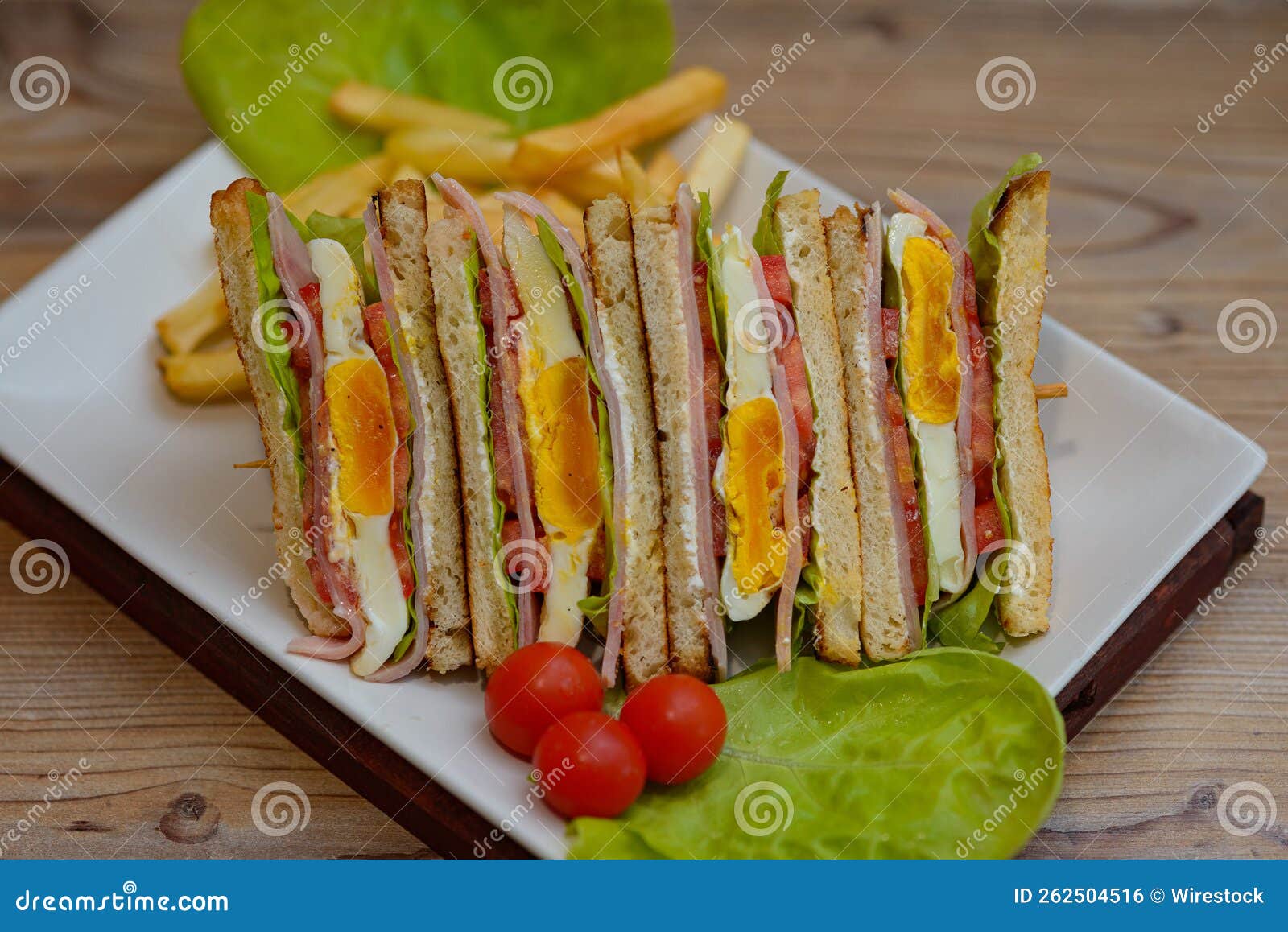 Selective Focus Shot of Triangle-shaped Sandwiches with Egg and Ham on ...