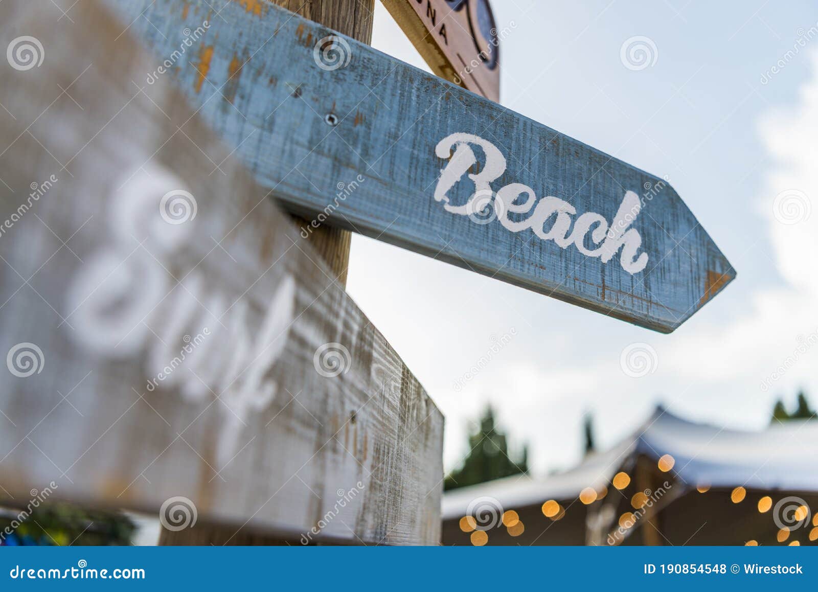 Selective Focus Shot of Wooden Beach Signage with a Blurred Background ...