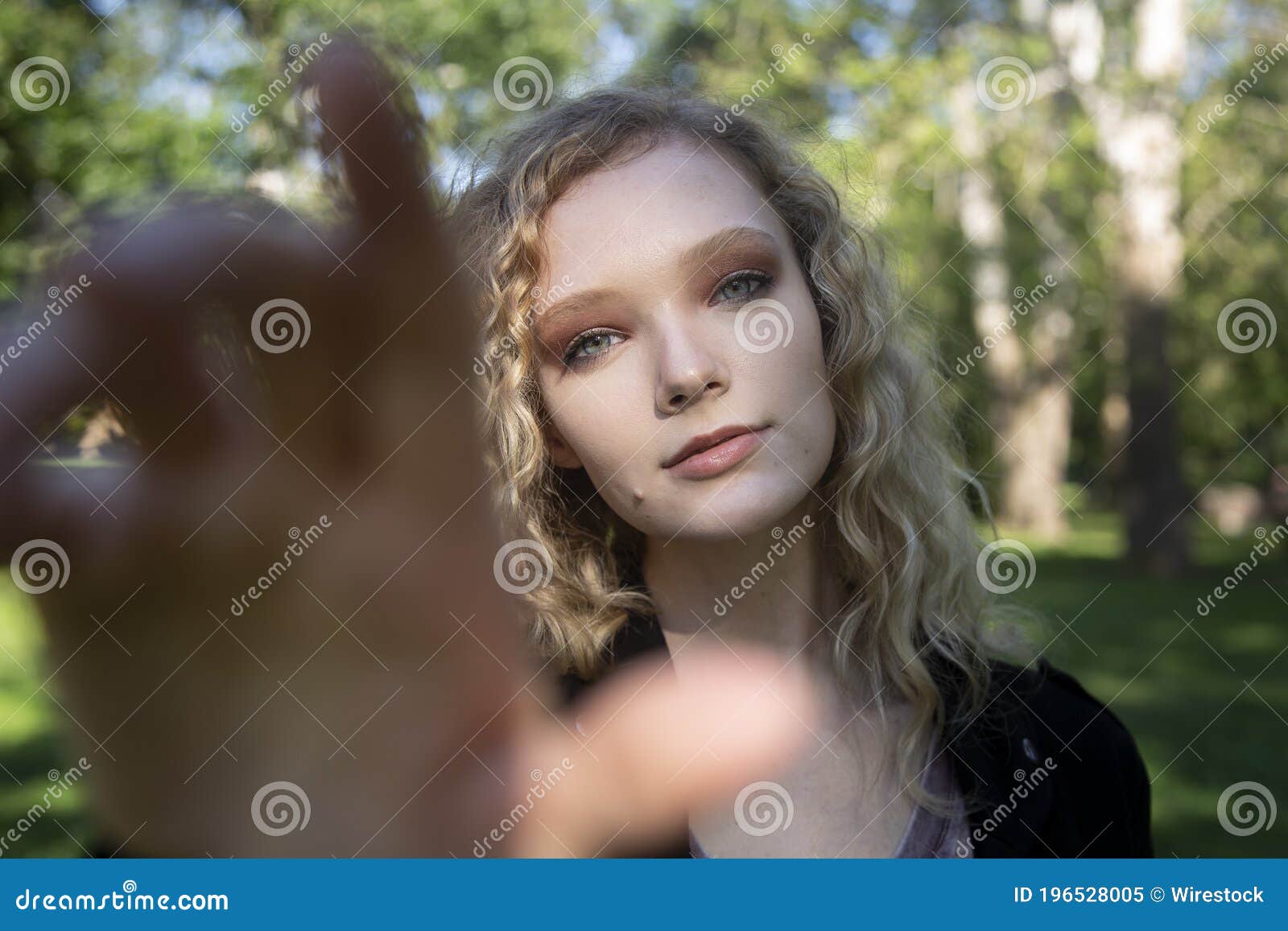 Selective Focus Shot Of A Young Attractive Female Posing At Camera