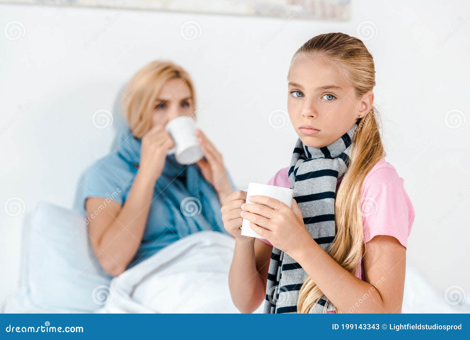 Focus of Sick Kid Holding Cup Near Mother Stock Image - Image of casual ...