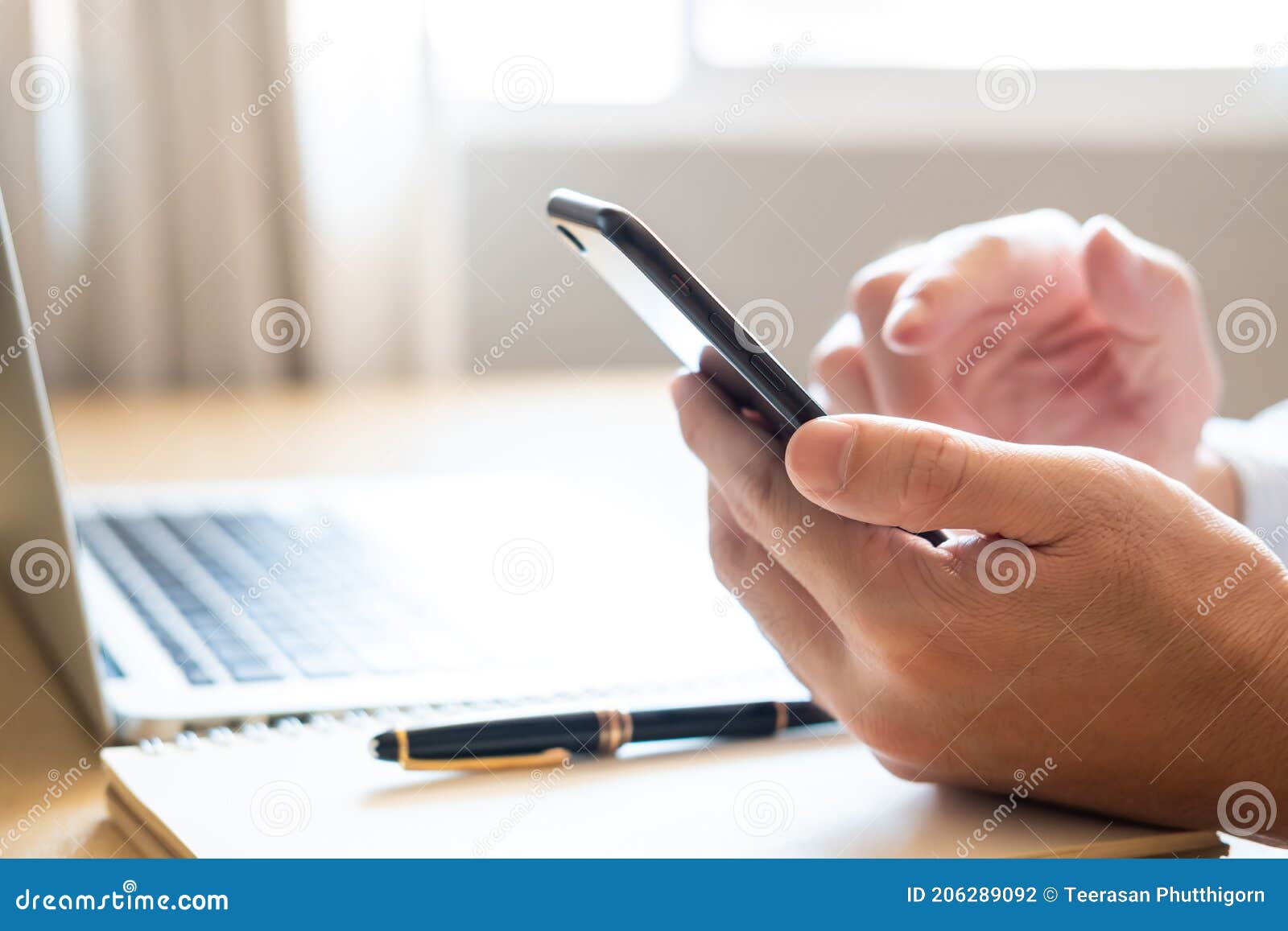 Selective Focus at Smartphone. Men Hand Holding Mobile Phone while ...