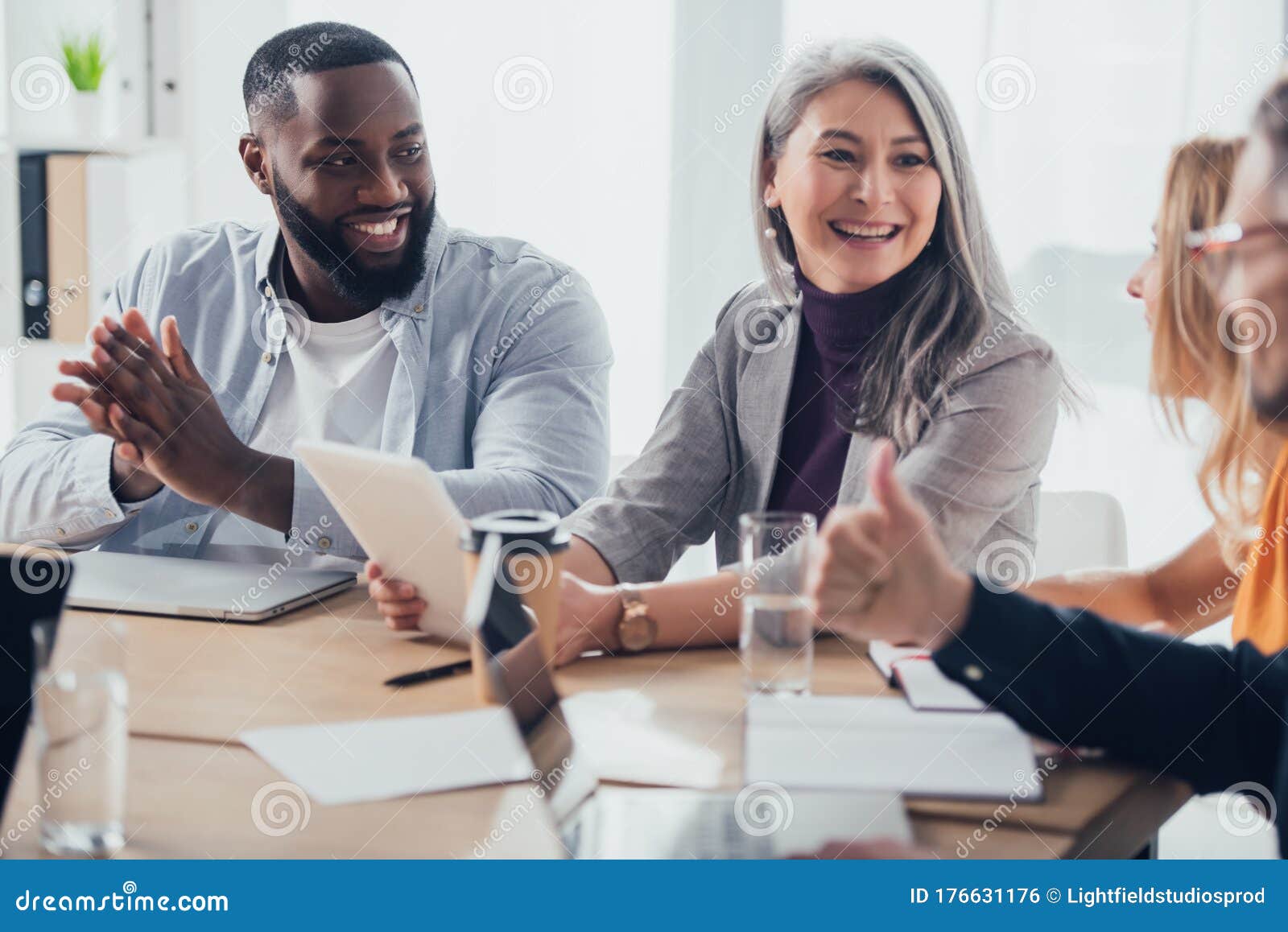 Focus of Smiling Multicultural Businesspeople Talking Stock Photo ...