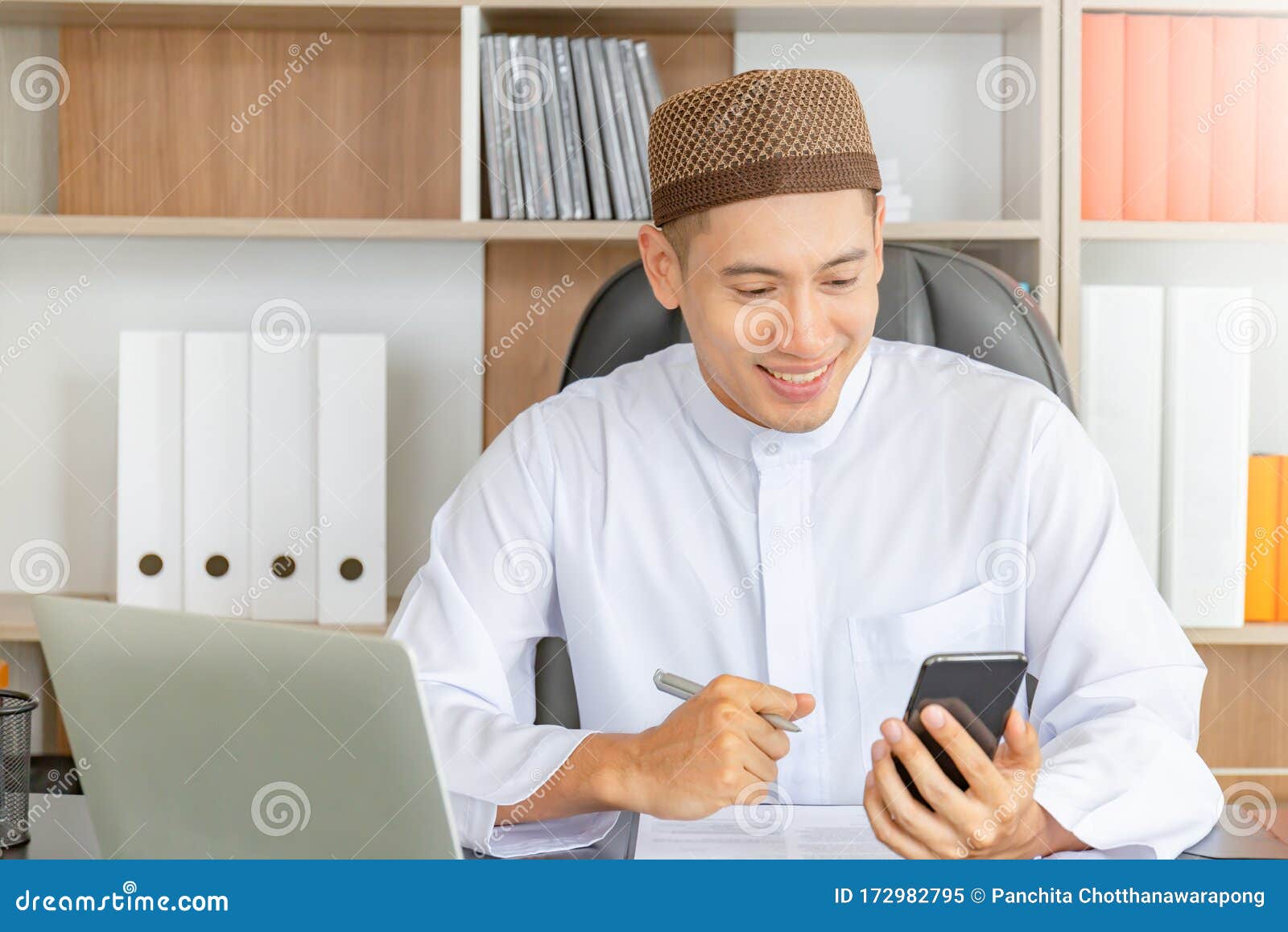 Selective Focus of Smiling Young Business Arab Middle Eastern Muslim ...