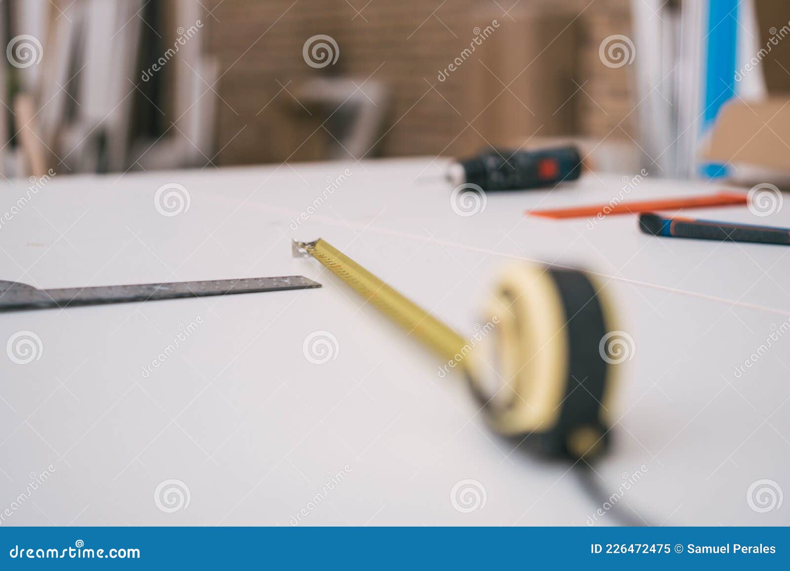 Tape Measure and Square on a White Table of a Workshop Stock Image ...