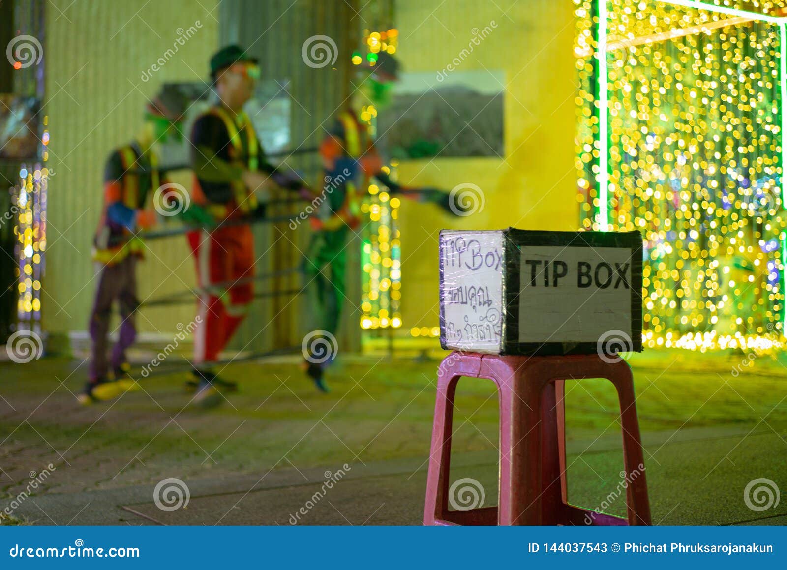 Selective Focus on Tip Box in Front of the Dancing Performance on the ...