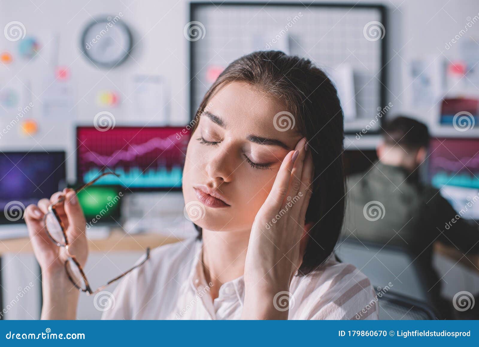 Selective Focus of Tired Data Analyst Touching Head while Colleague ...