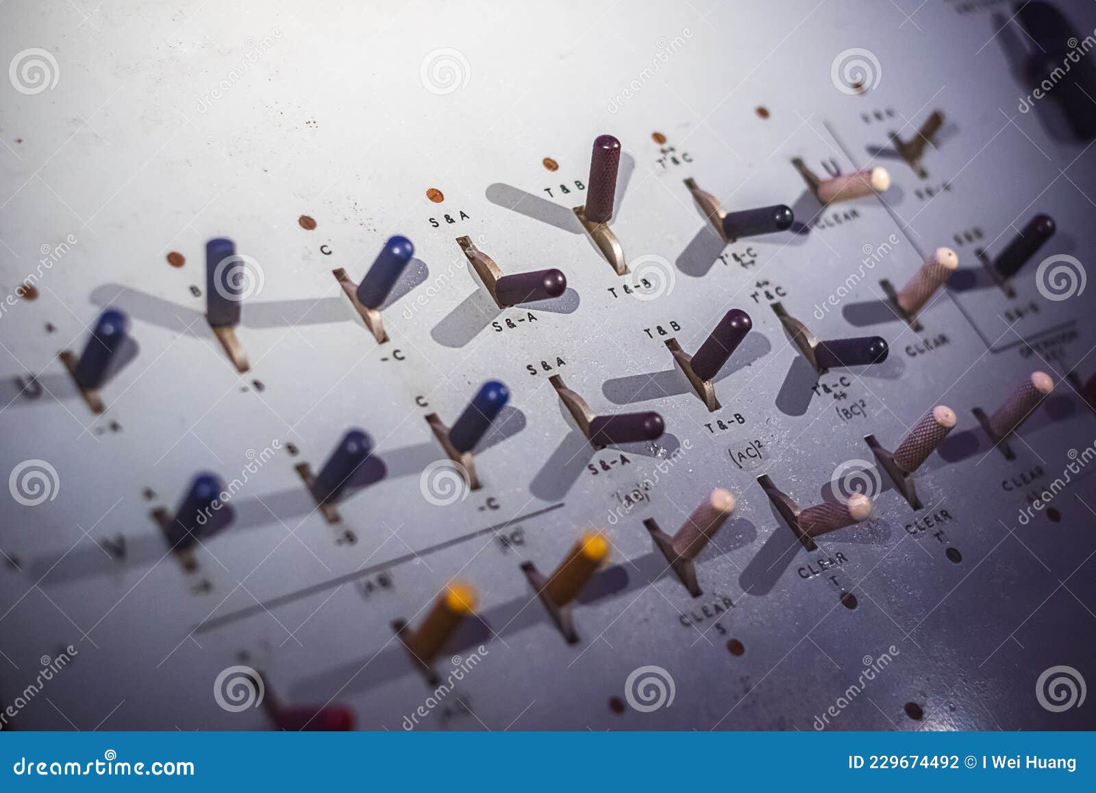 A Man Switches The Toggle Switches Of The Electrical Panel On The Pole ...