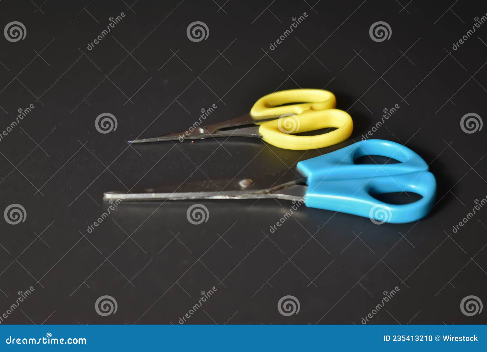 Selective Focus of Two Scissors Against a Black Backgrounf Stock Photo ...