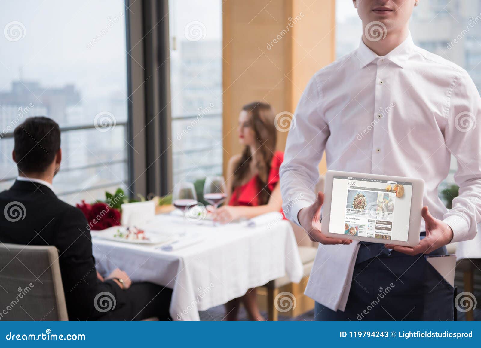 Selective Focus of Waiter Showing Tablet in Hands Editorial Stock Photo ...