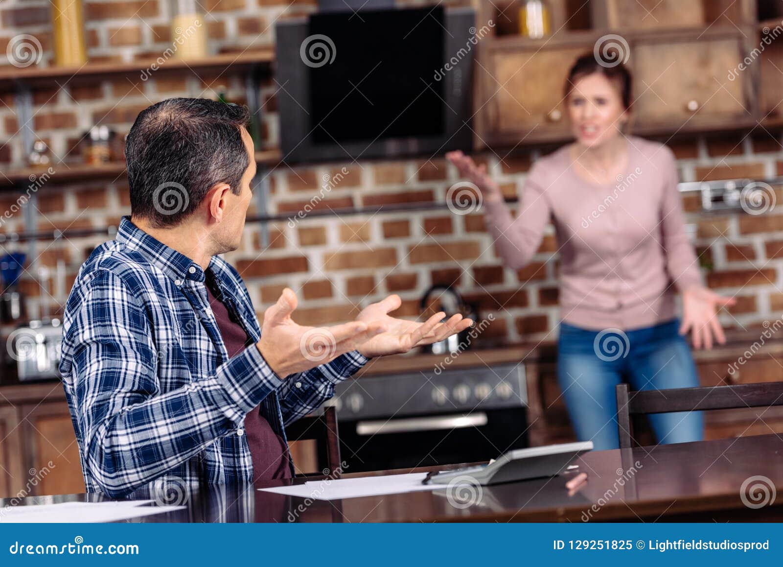 Selective Focus of Wife and Husband Having Argument in Kitchen at Home ...