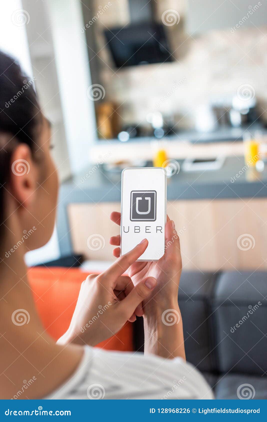 Selective Focus of Woman Using Smartphone with Uber Logo on Screen ...