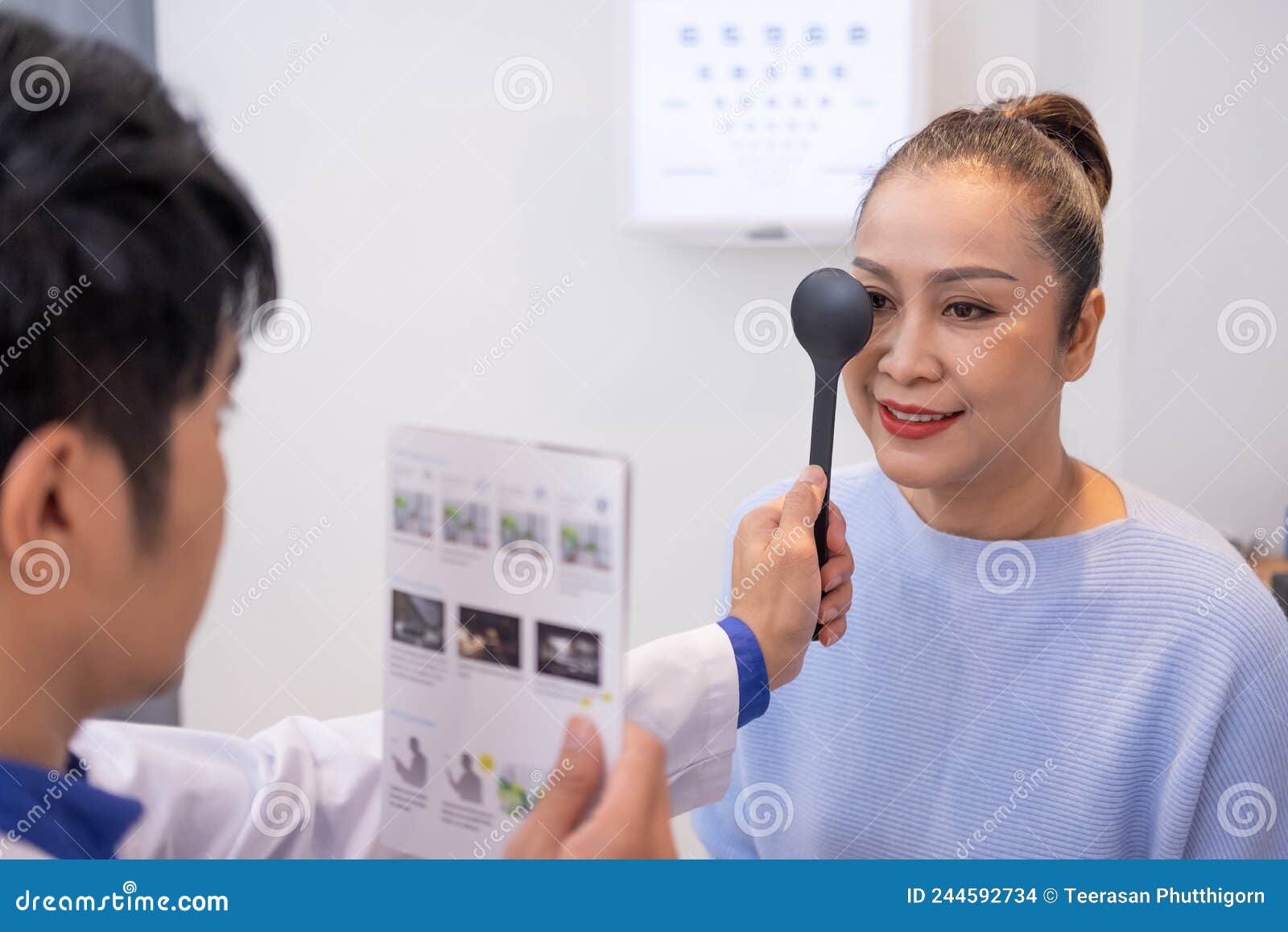 Selective Focus at Women Face. while Doctor Using Optometry Equipment ...