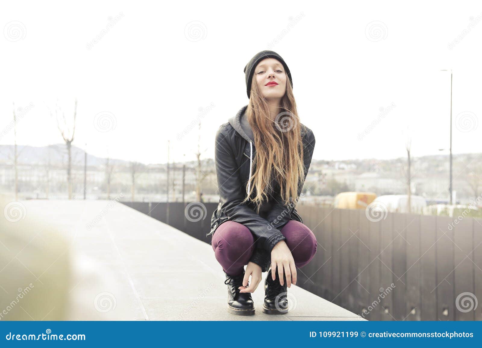 Selective Photo Of Woman In Gray Hooded Jacket Doing Crouch Position ...