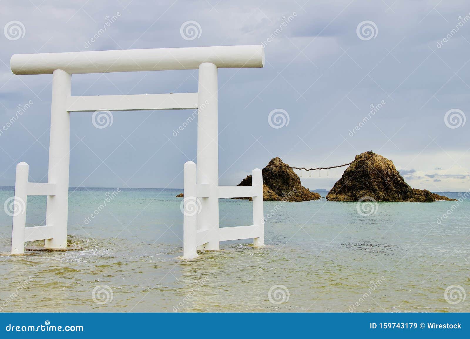 Selective Shot of a Japanese White Gate in Itoshima Beach with Cliffs ...