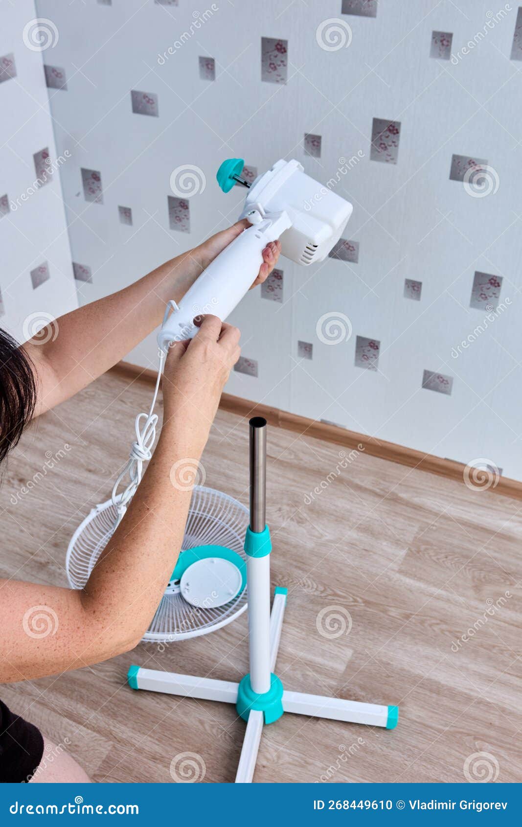 Self Assembly of Floor Fan from Factory Packaging at Home. Stock Photo ...