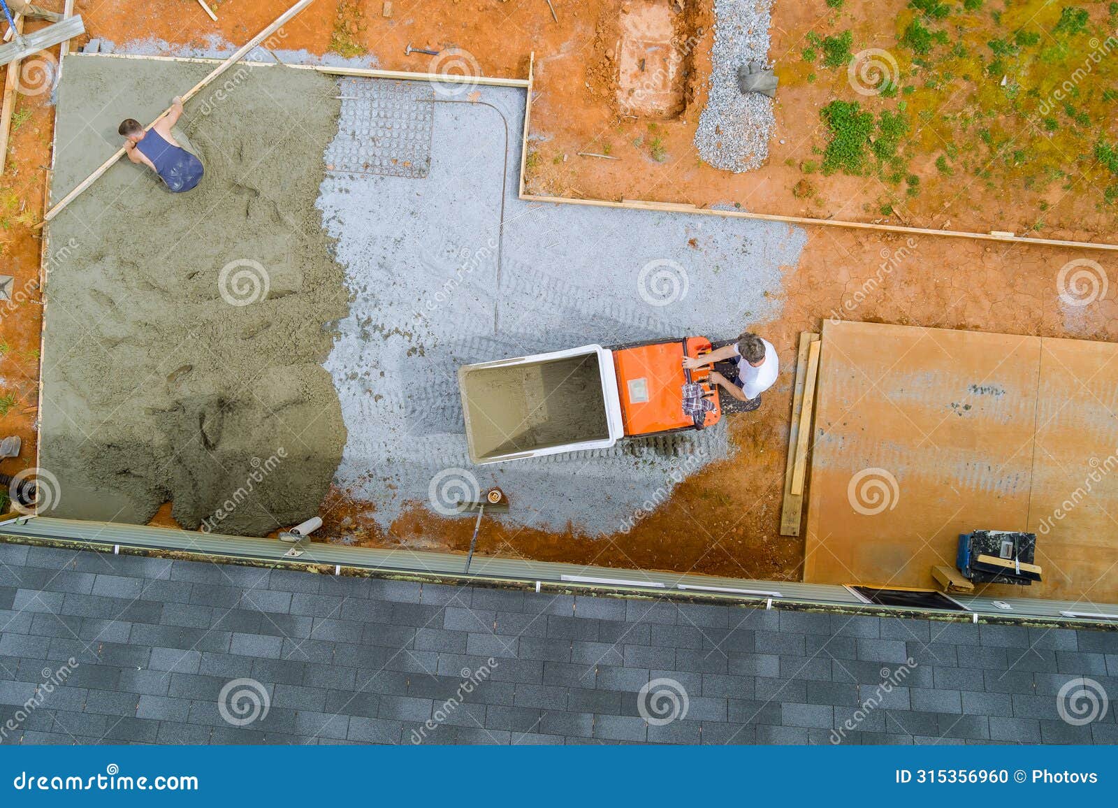 Self Dumping Track Concrete Buggy is Used To Pour Wet Cement into a ...