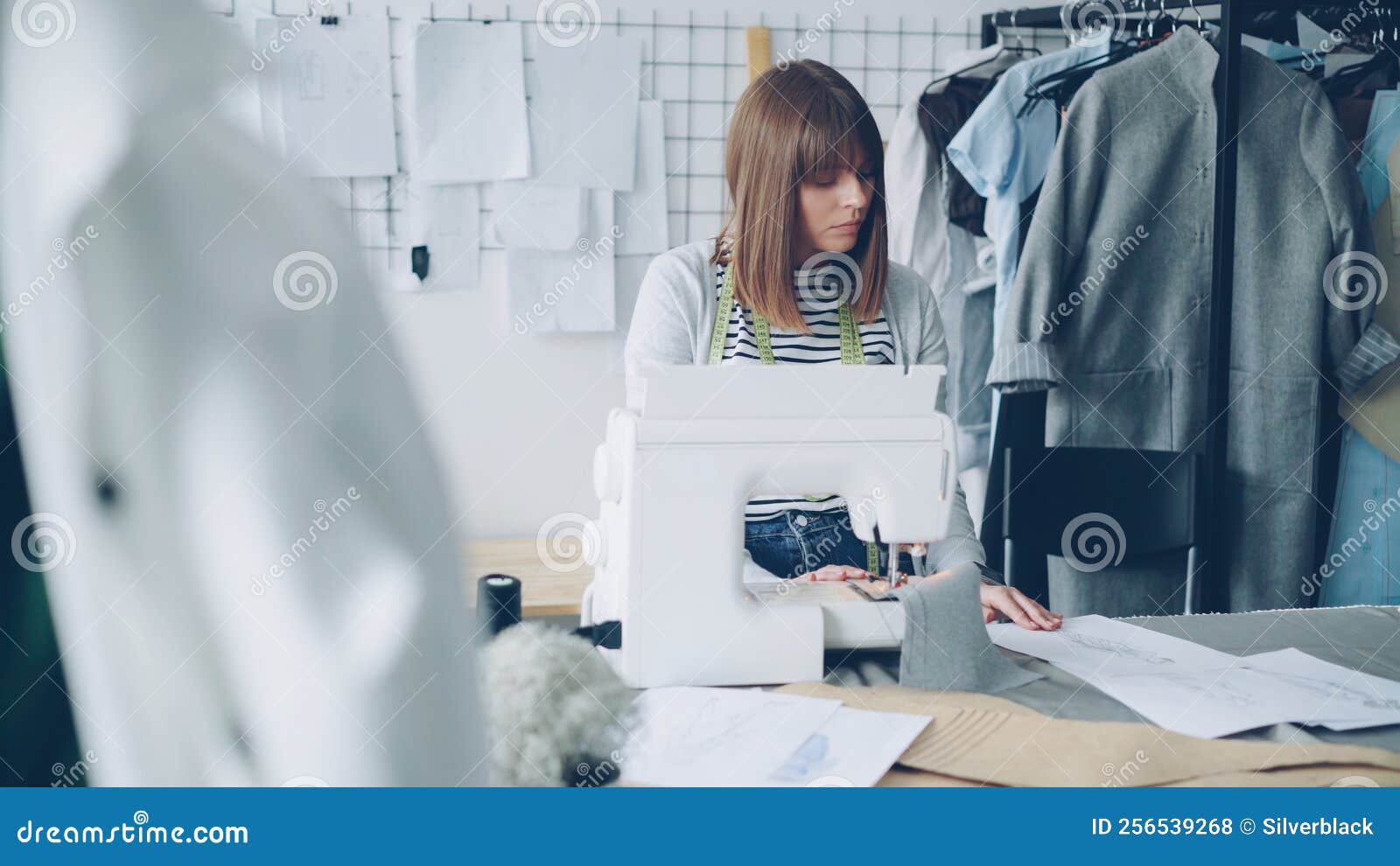 Self-employed Clothing Designer is Working with Sewing Machine ...