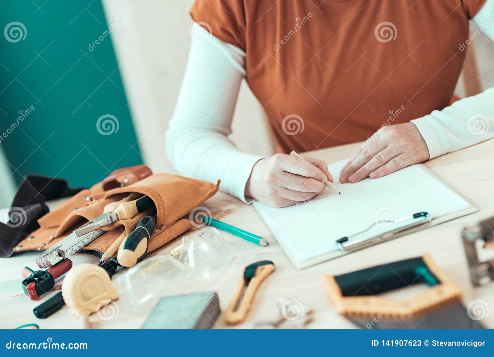 Self Employed Female Carpenter Writing Project Notes Stock Image ...
