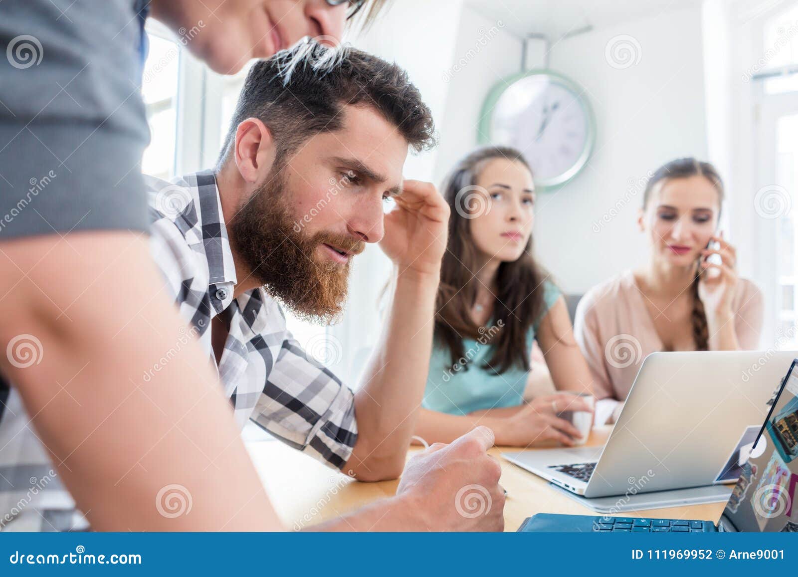 Self-employed Young Man Analyzing a Difficult Task while Working Stock ...