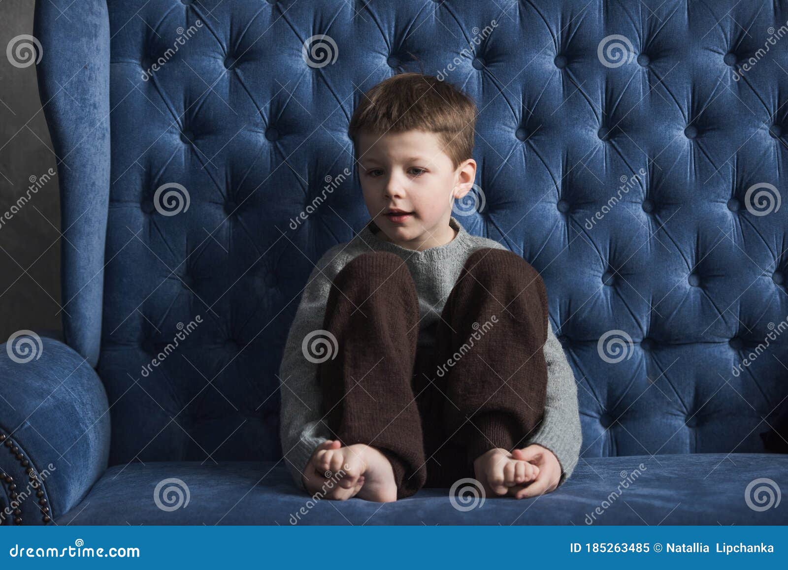 During Self-isolation a Boy Sits on Blue Sofa Stock Image - Image of ...
