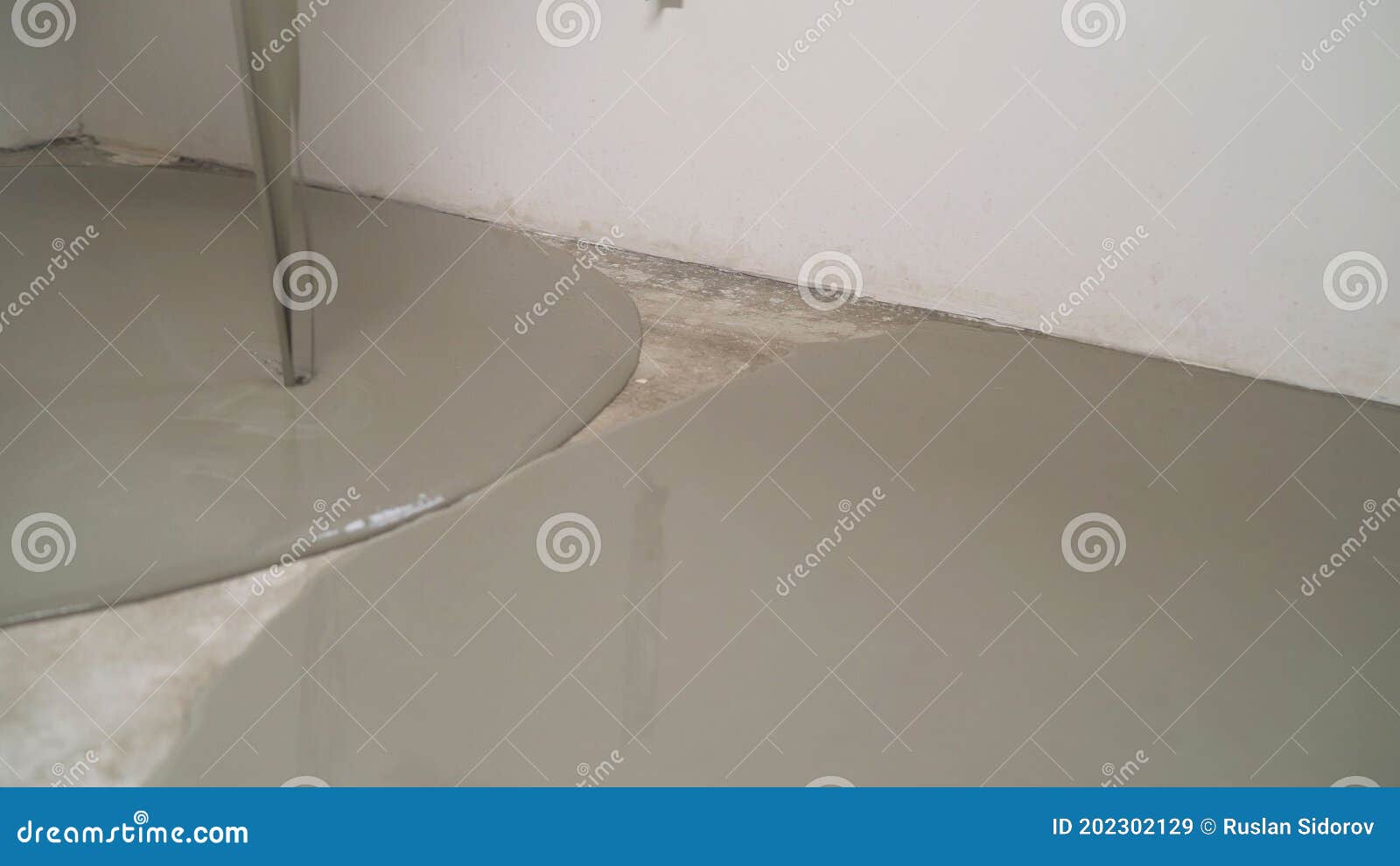 Leveling The Floor With A Long Spatula. Builder Levels A Laid Floor ...