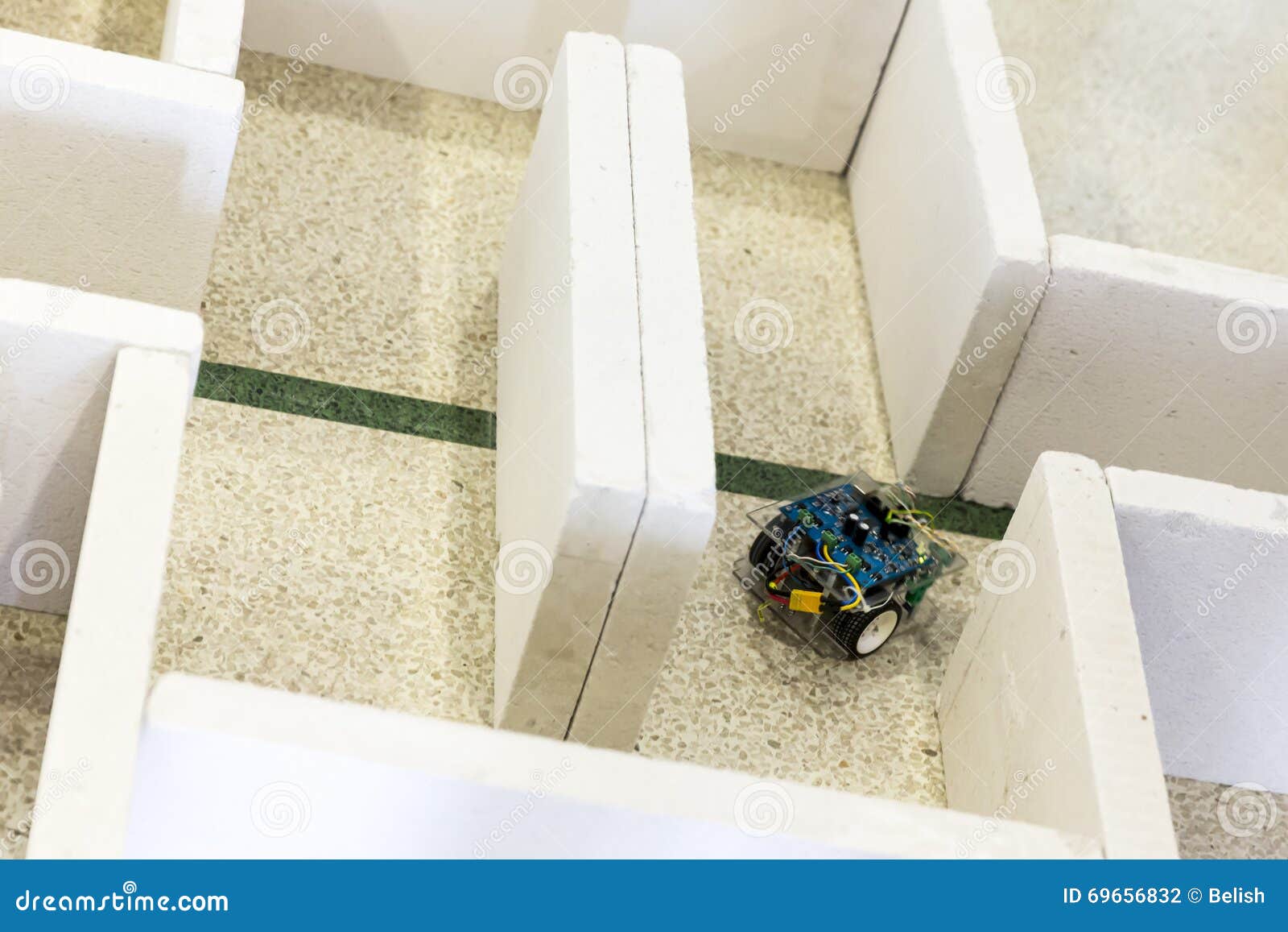 Self-made robot in a maze stock photo. Image of robot - 69656832