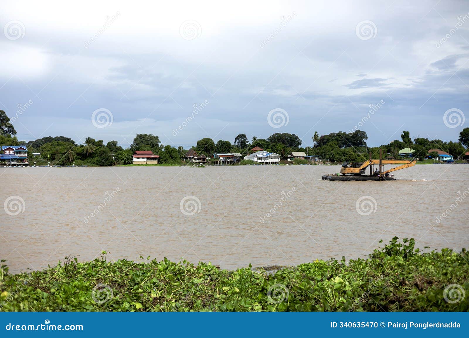 Self Propelled Barge Transporting an Excavator on the River Stock ...