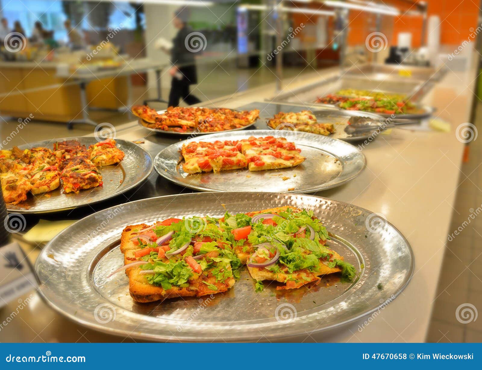 Self Serve Pizza at a Cafeteria with Diners and Waiter Stock Photo ...