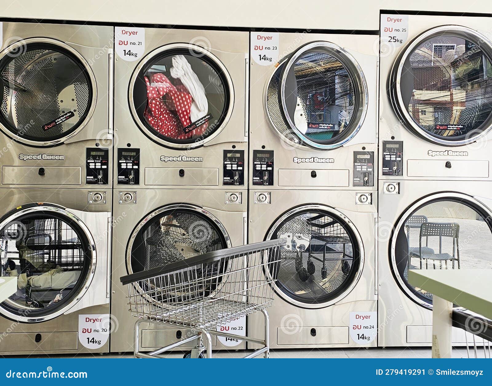 Self-service Laundry Automatic Washing Machines with Clothes Inside at ...