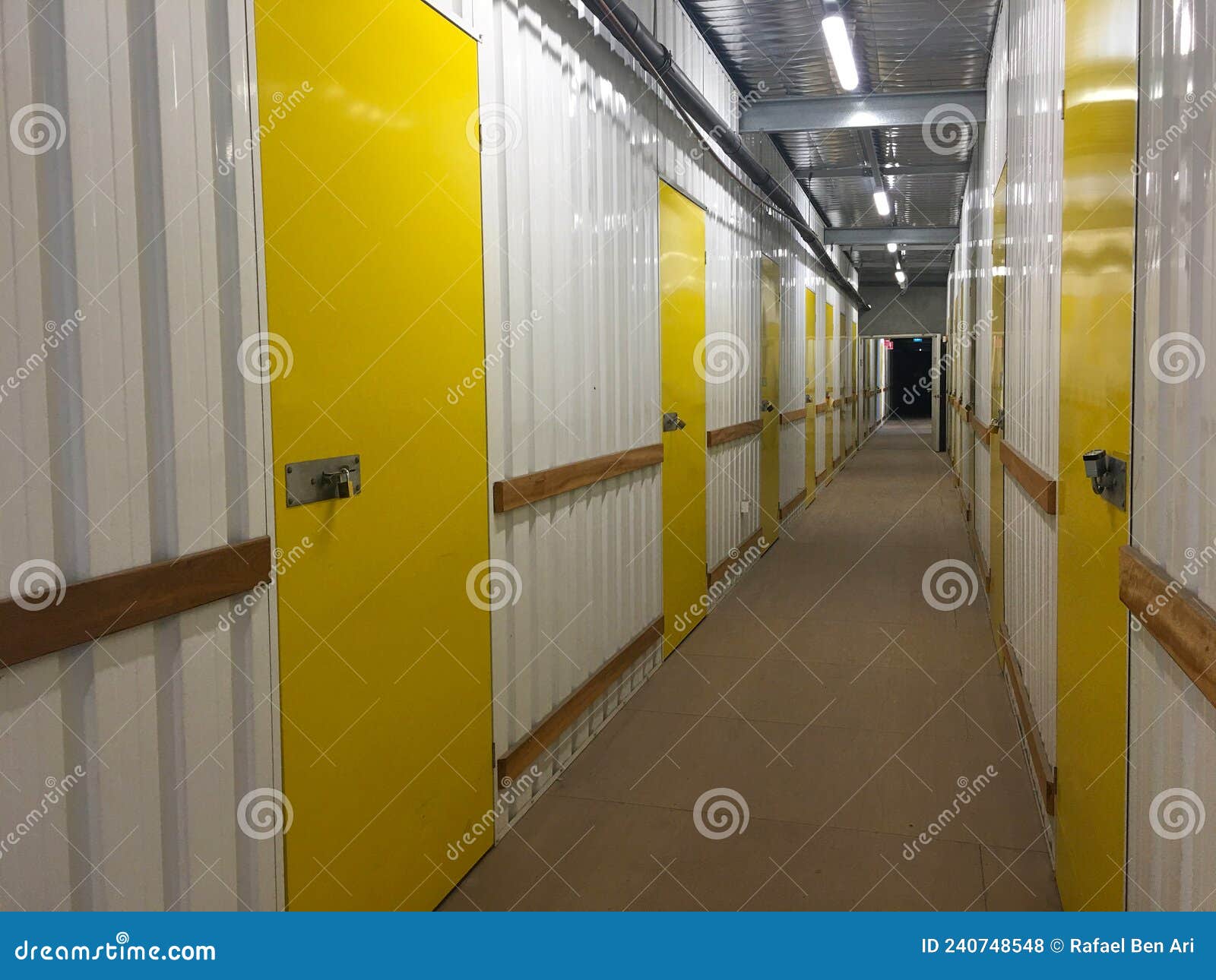 Corridor Full of Yellow Doors in Self Storage Building Stock Photo ...