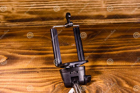 Selfie Stick with Adjustable Clamp on a Wooden Table Stock Image ...
