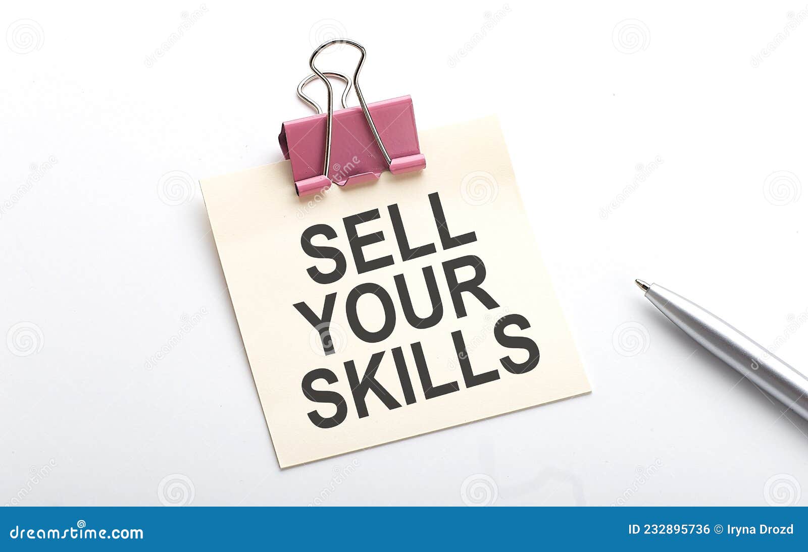 SELL YOUR SKILLS Text on the Sticker with Pen on the White Background ...