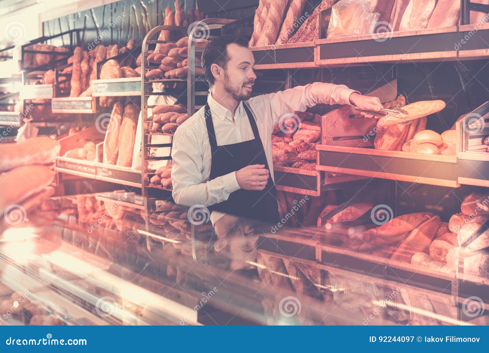 Seller Offering Fresh Loaf of Bread Stock Image - Image of male ...