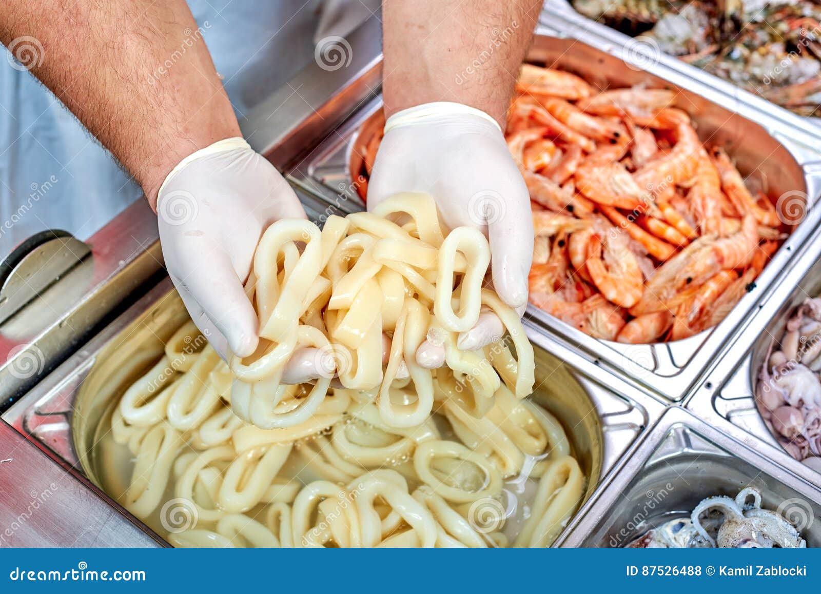 Seller Presenting Sliced Calamari Stock Photo - Image of market, shop ...
