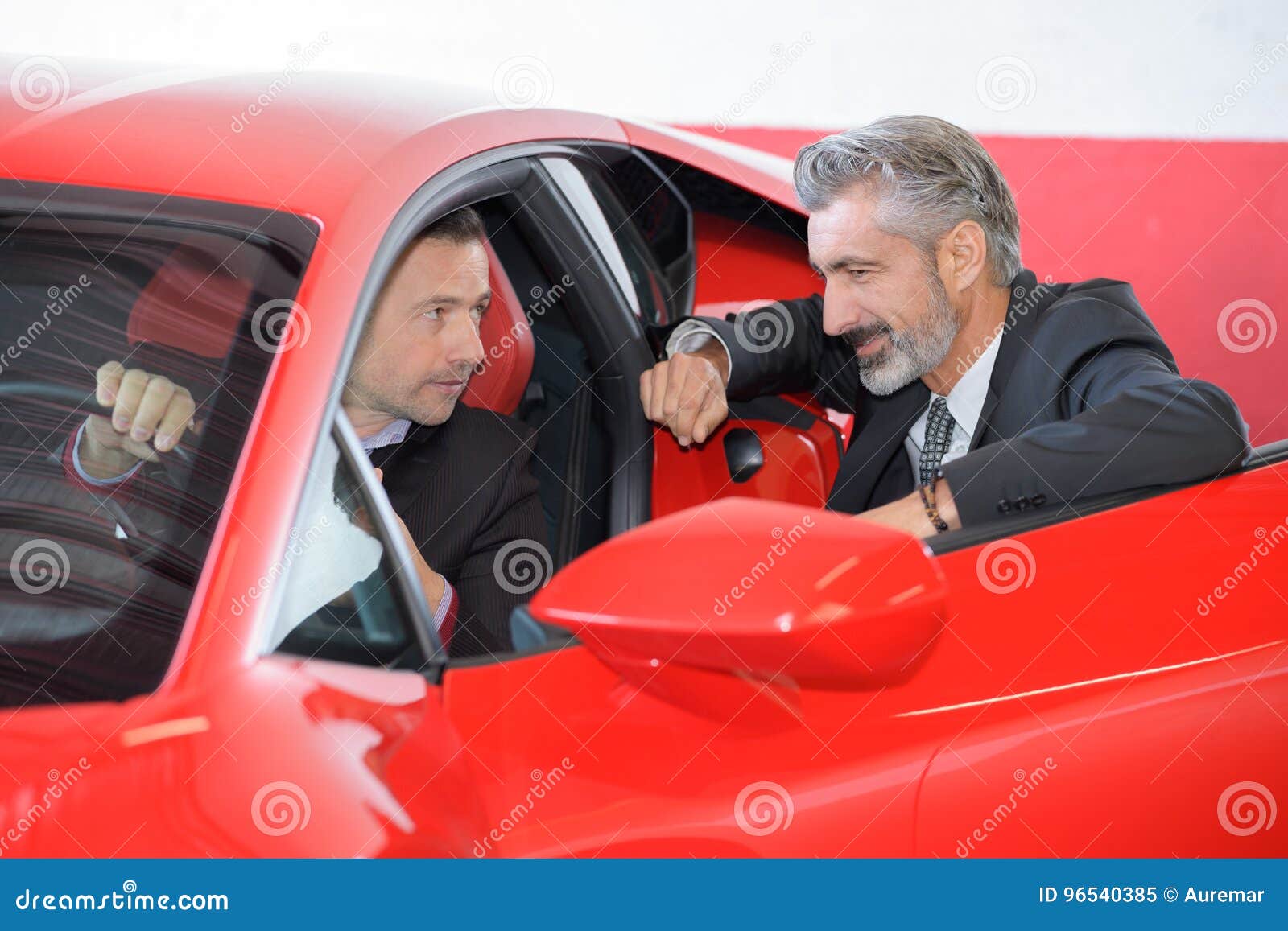 Seller and Rich Customer Discussing Ferrari Performances Editorial ...