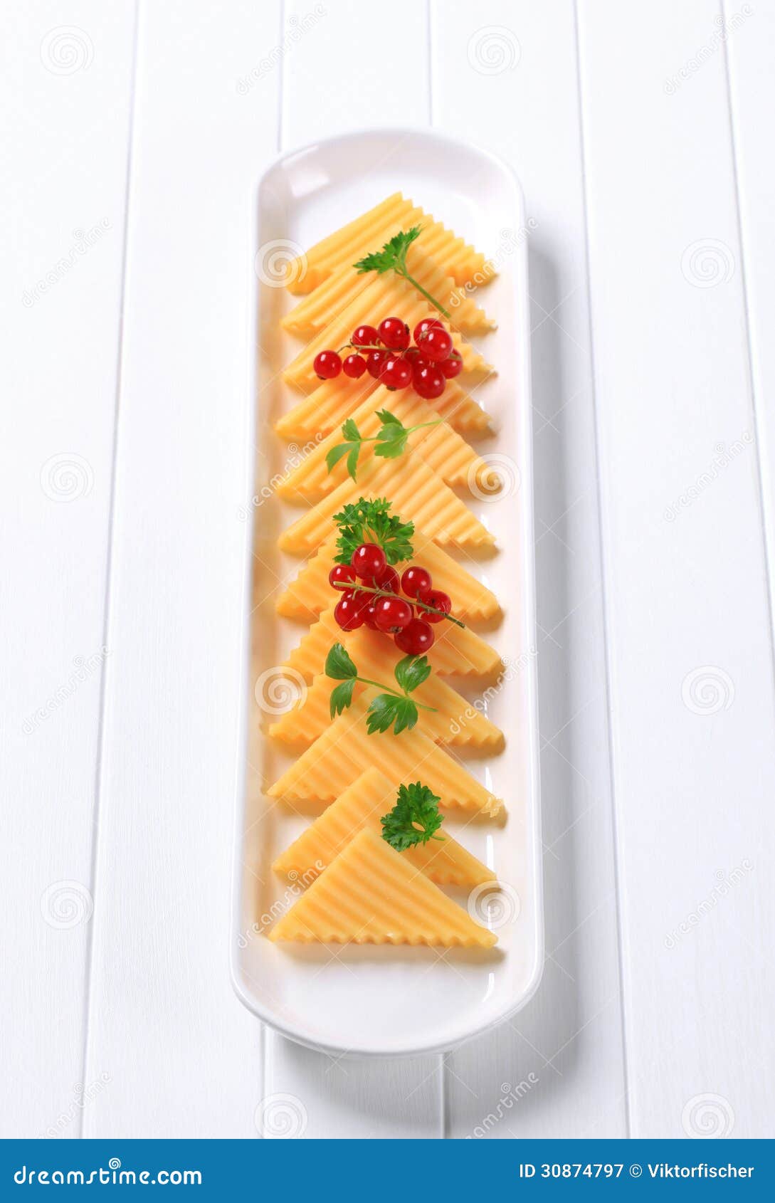 Semi-hard cheese triangles stock image. Image of dish - 30874797