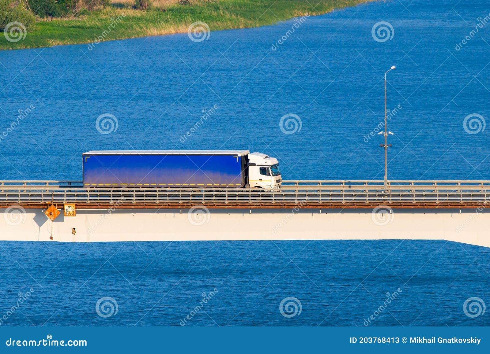 Semi-truck with Cargo Trailer Driving on a Bridge Stock Image - Image ...
