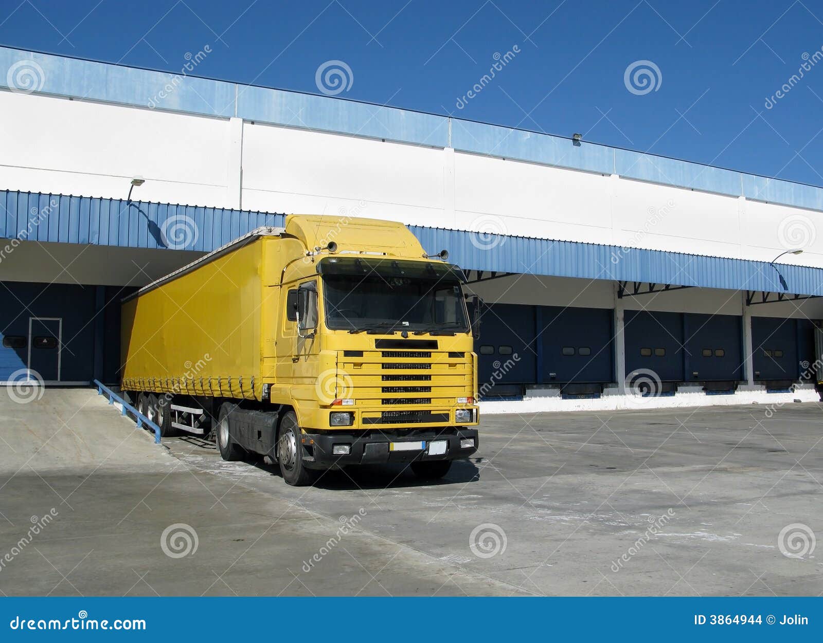 Semi truck in loading dock stock photo. Image of diesel - 3864944