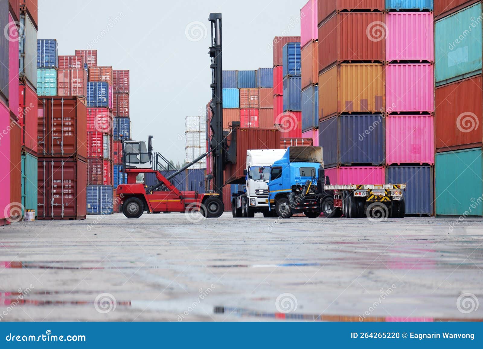 Semi-trucks and Container Lifters in the Container Yard Stock Photo ...