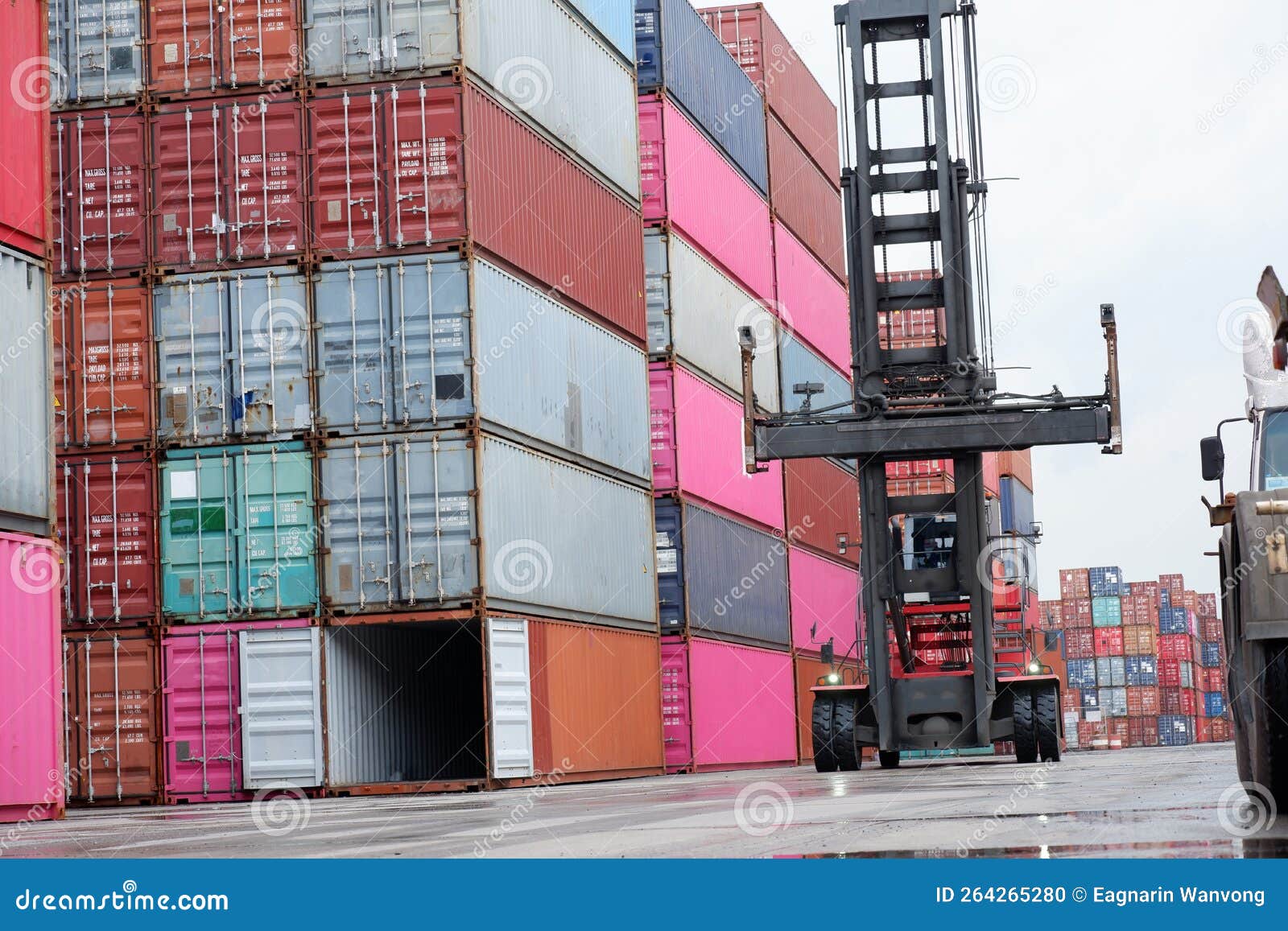 Semi-trucks and Container Lifters in the Container Yard Stock Photo ...