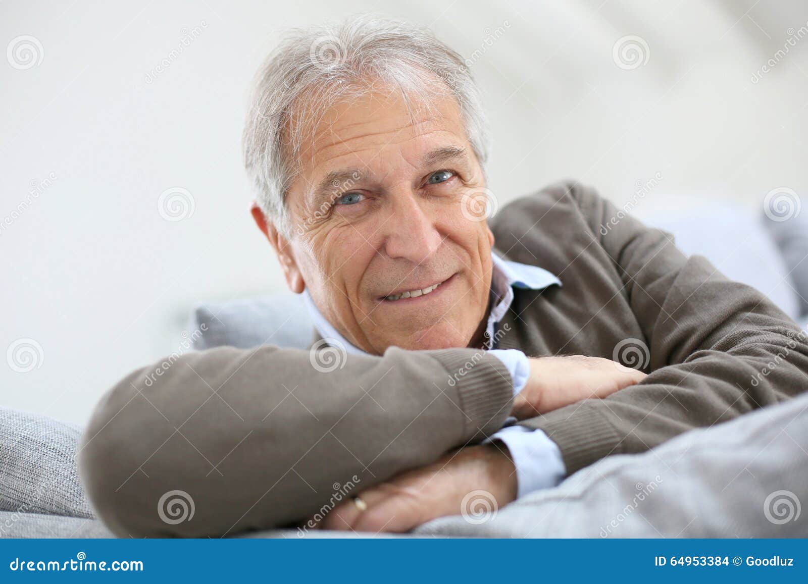 Semiling Senior Man on Sofa Stock Photo - Image of interior, people ...