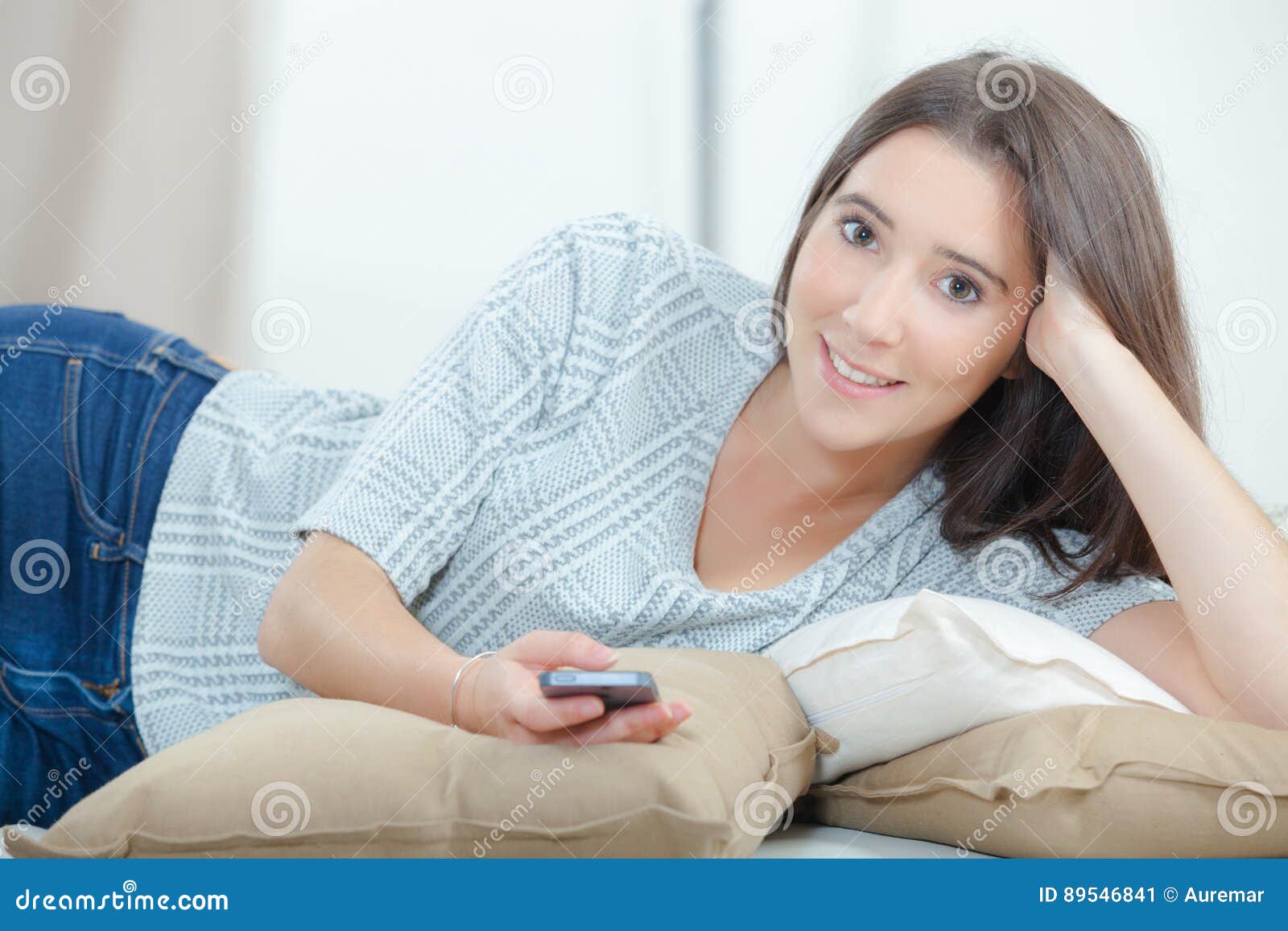 Sending Text Message from Sofa Stock Image - Image of phone, cellphone ...