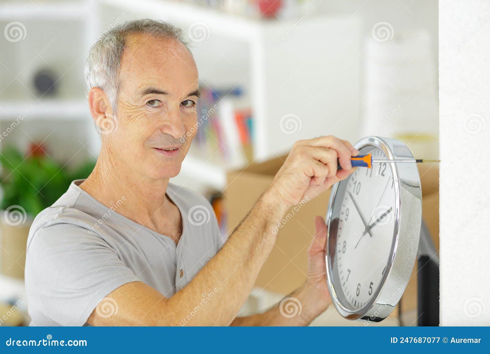 Senior Adjusting Clock at Home Stock Image - Image of craftsman ...