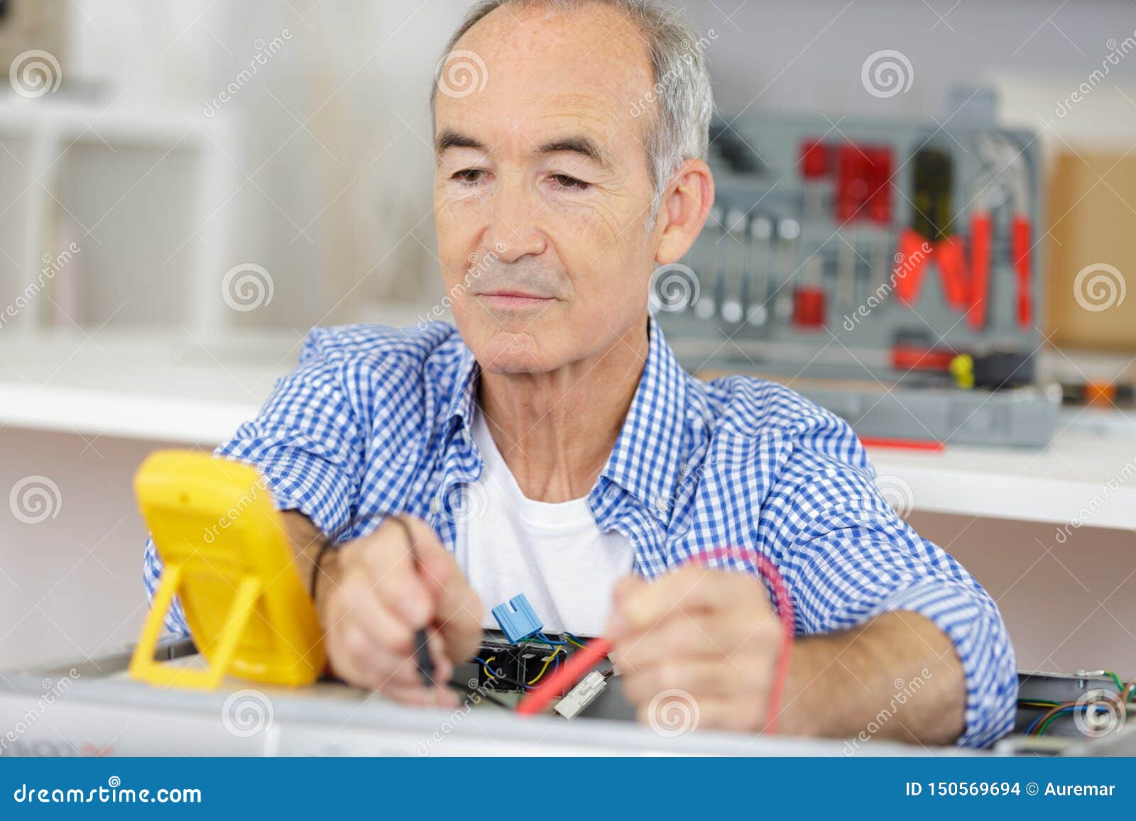 Senior Adult Electrician Using Electrical Test Pen Stock Photo - Image ...