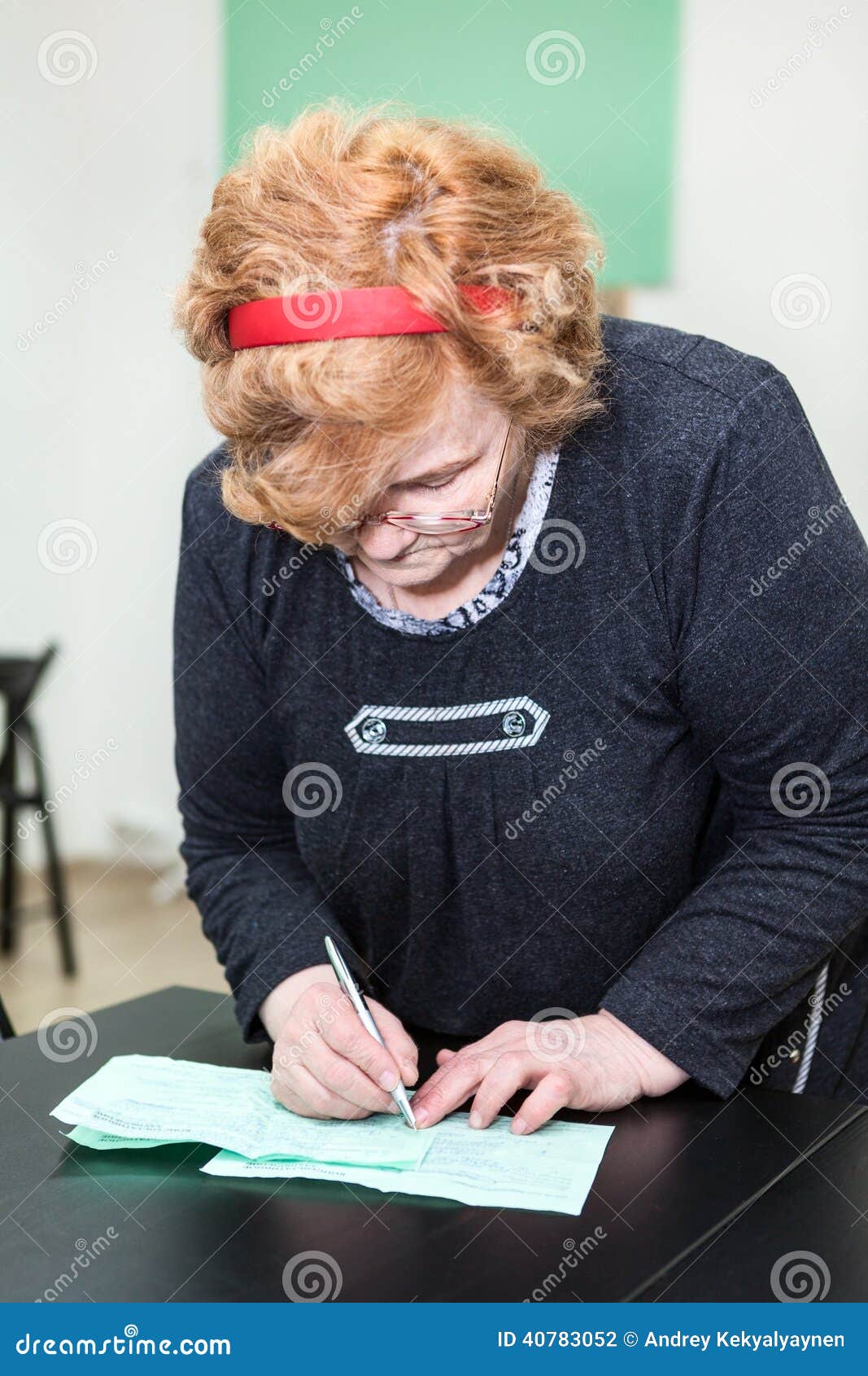 Senior Age Woman Writing Forms at Table Stock Photo - Image of female ...