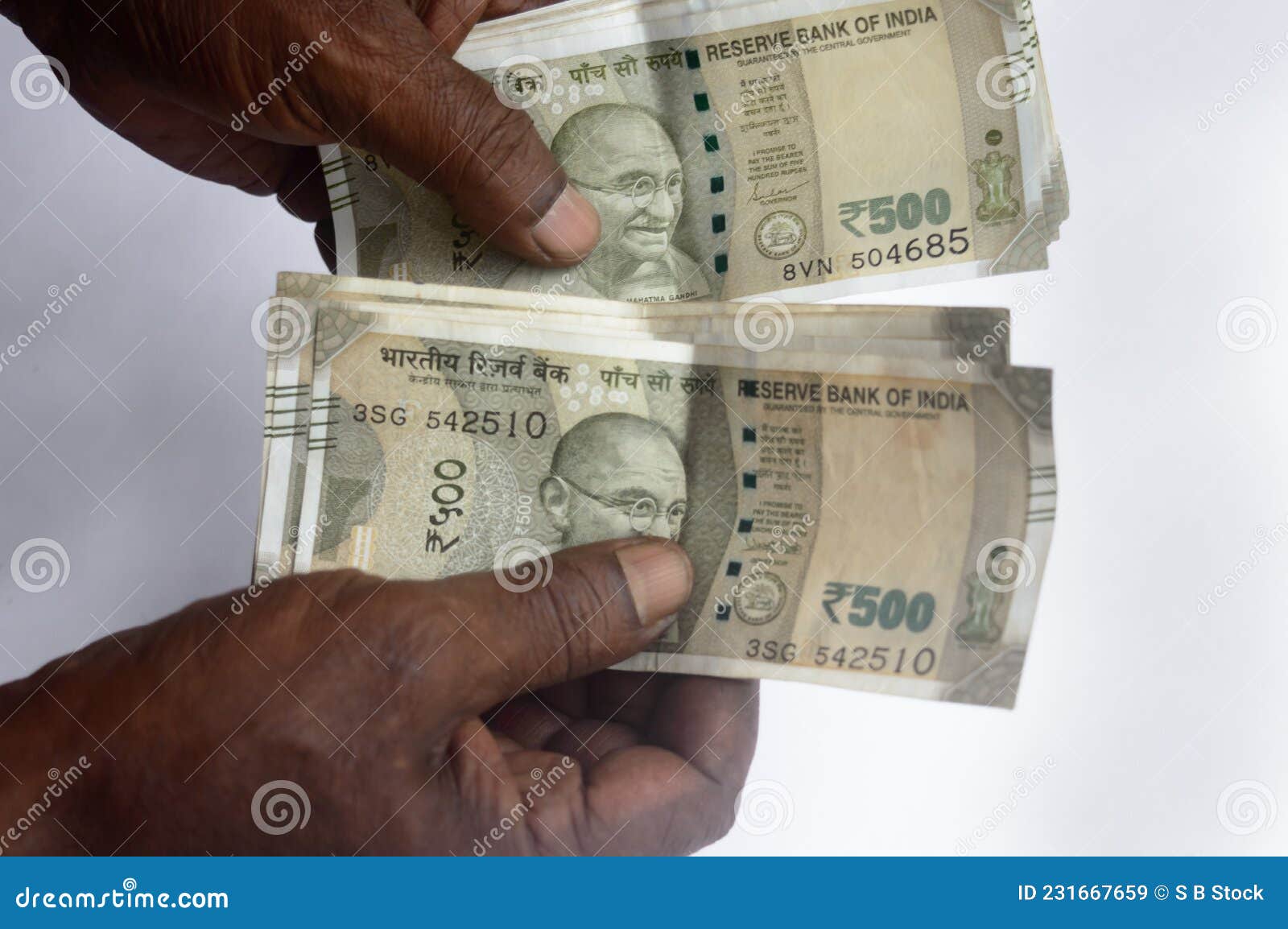 Senior Aged Man Hand Counting Indian Rupee Note on Table. High Angle ...