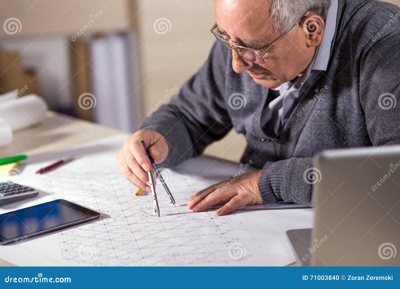 Senior Architect Working on Construction Blueprint in Office Stock ...
