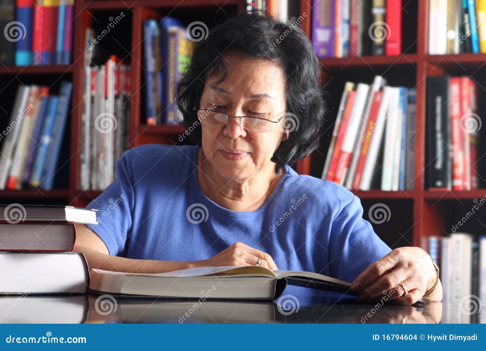 Senior Asian Lady Reading in Library Stock Photo - Image of clothing ...