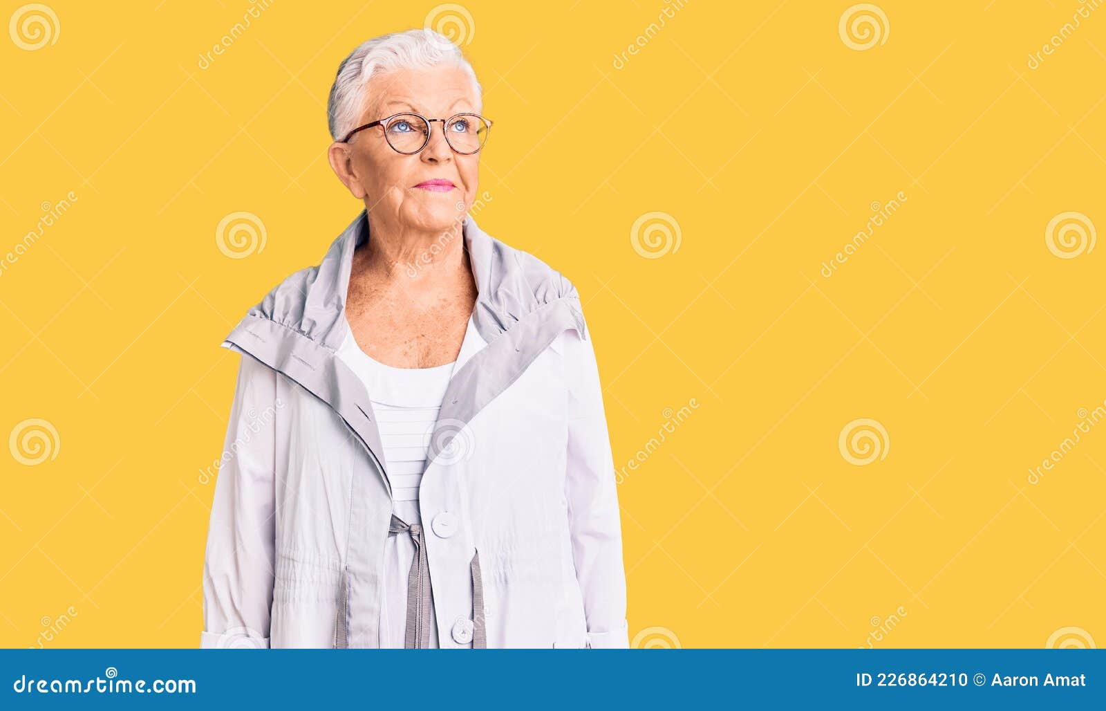 Senior Beautiful Woman With Blue Eyes And Grey Hair Wearing Casual